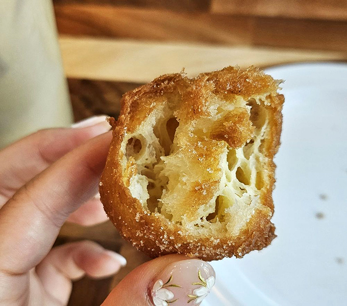 This pastry's honeycomb interior reveals the mark of true craftsmanship—crispy outside, airy inside, and worth every calorie.