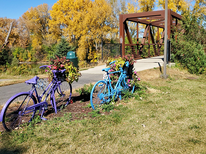 The bike trail entrance looks like the gateway to a Wes Anderson film set &ndash; complete with color-coordinated bicycles that seem to be waiting for their cue.