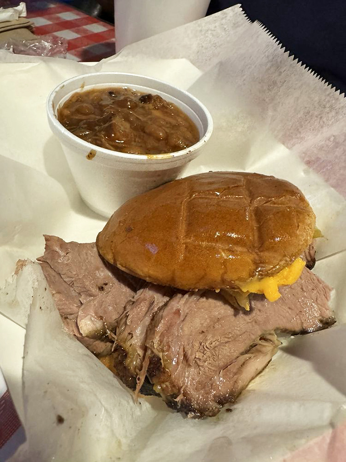 A proper brisket sandwich should require both hands and several napkins. This one passes the test with smoky, succulent flying colors.