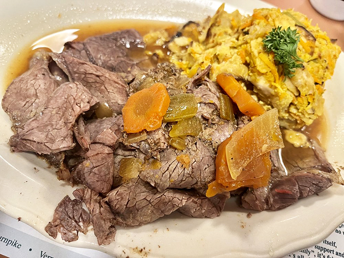 Brisket that doesn't need a knife, just a gentle nudge with your fork, served alongside kugel that would make any bubbe kvell with pride.