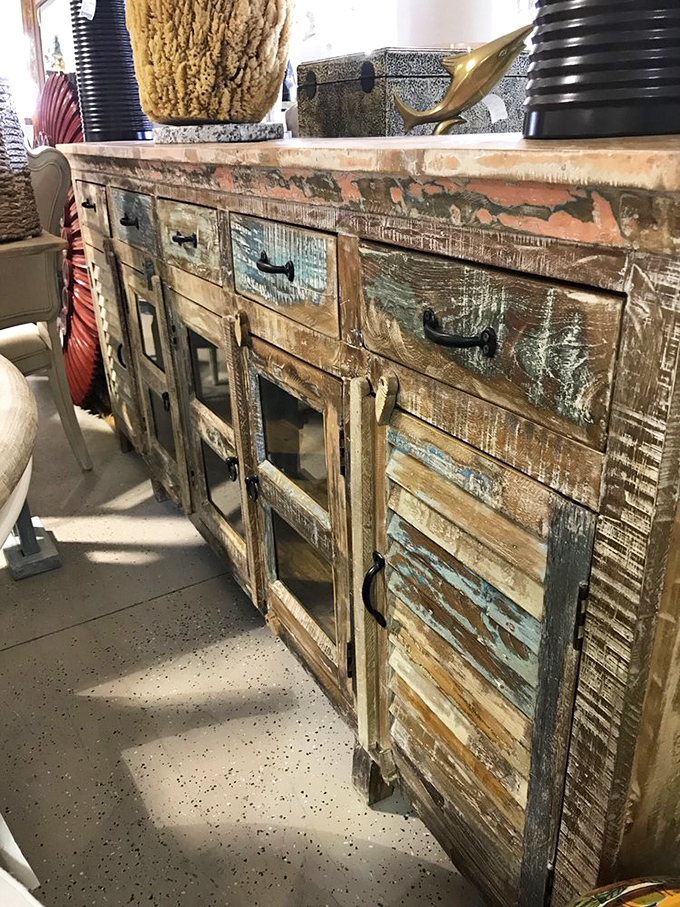 This weathered cabinet has more character than most Netflix series—each scratch and color patch telling stories of sunny Florida afternoons.