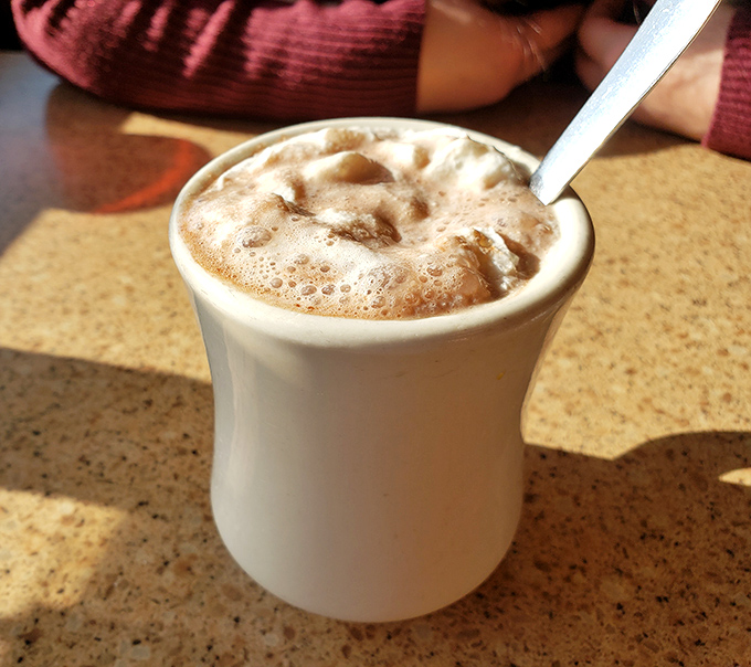 This isn't just coffee&mdash;it's a frothy, creamy lifeline to civilization. The kind of cup that makes Monday mornings slightly less criminal. 