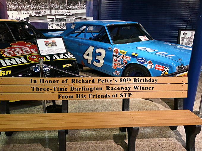 Richard Petty's famous #43 gets the VIP treatment with its own commemorative bench. Even racing royalty needs a place to sit!