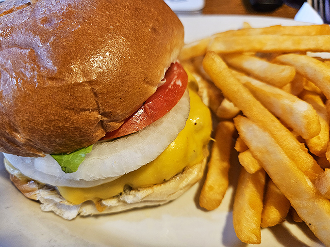 The classic American cheeseburger&mdash;juicy, perfectly proportioned, and flanked by golden fries. Some food traditions don't need reinvention, just respectful execution.