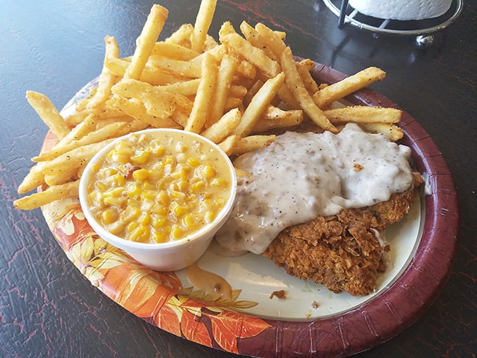 Southern hospitality on a plate: chicken-fried steak with creamy gravy, golden fries, and corn that somehow counts as a vegetable in this delicious equation.