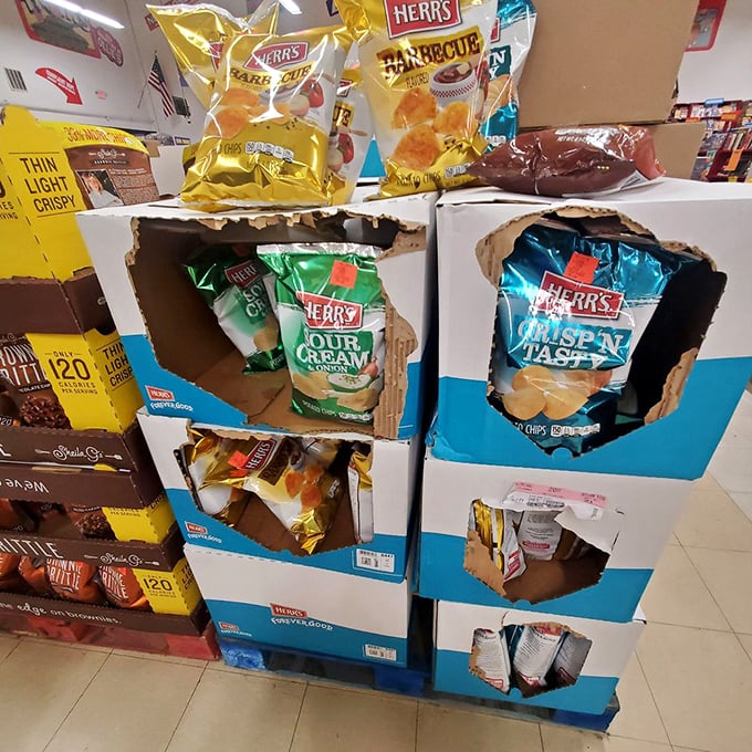 Herr's chips display showcases the beautiful chaos of Ollie's food section&mdash;where snack discoveries await those brave enough to explore beyond their usual grocery aisles.