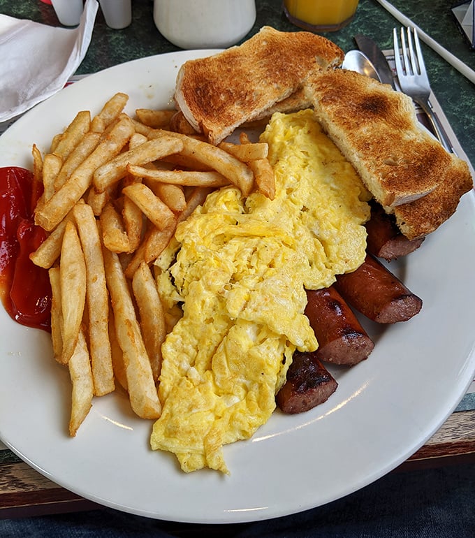 The breakfast trinity &ndash; fluffy scrambled eggs, sausage links with perfect snap, and toast that's achieved that elusive golden-brown perfection.
