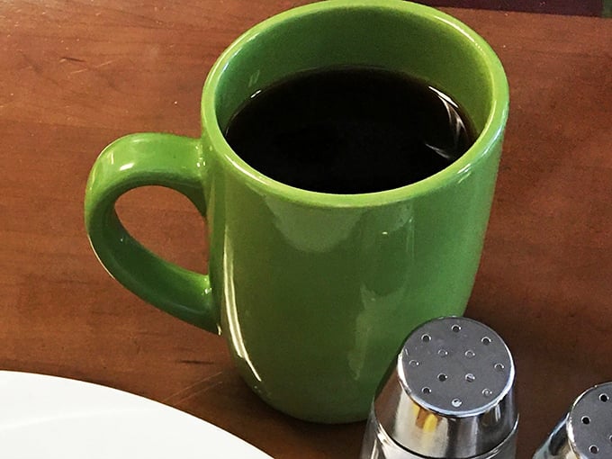 The signature green mug doesn't just hold coffee; it holds the promise of civilization in a desert city that never sleeps.