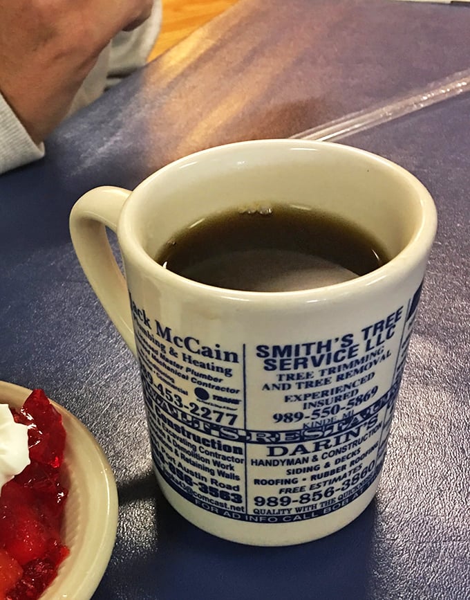 The coffee mug doubles as local yellow pages&mdash;because in small-town Michigan, your breakfast should come with community connections and unlimited refills.
