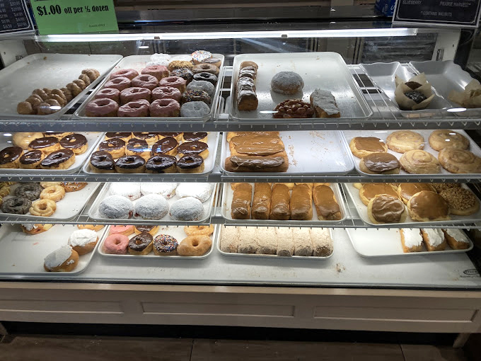 Donut display cases: where dieters' willpower goes to die and breakfast becomes an all-day affair. Each ring of fried dough is a little halo of happiness.