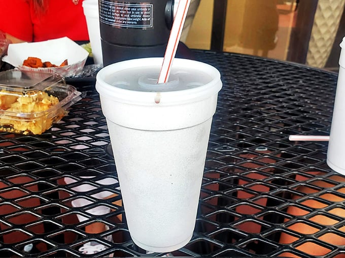 That innocent-looking styrofoam cup contains sweet tea so legendary it deserves its own documentary series. Refills aren't just offered—they're expected.