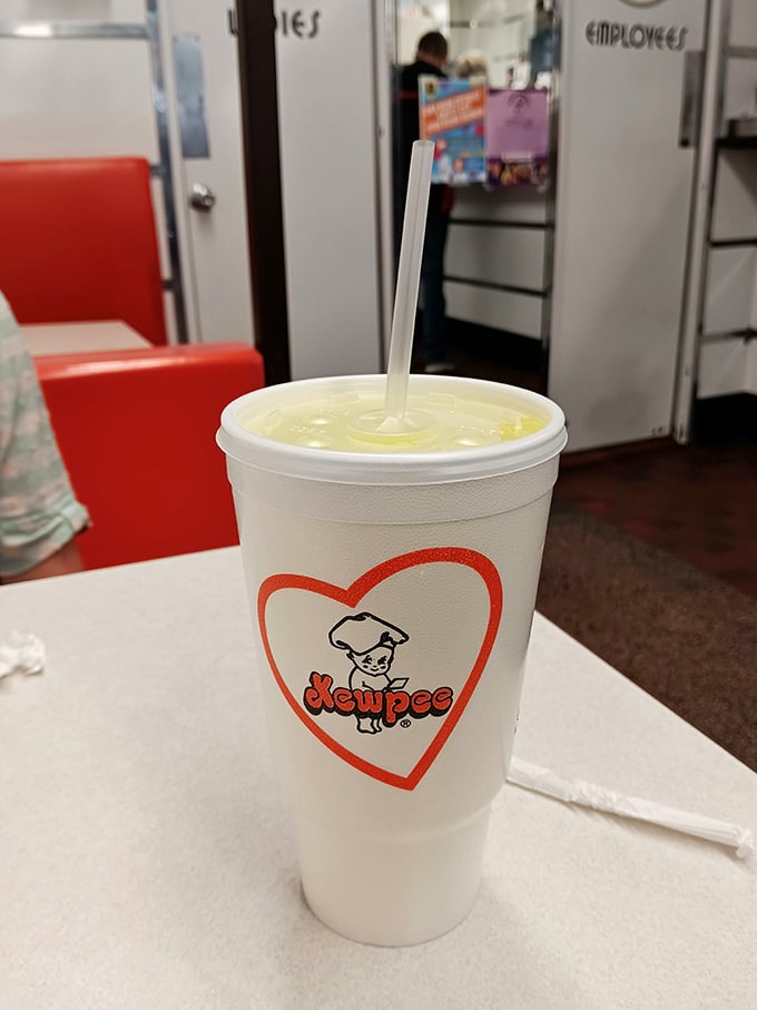 That signature cup isn't just holding a drink; it's cradling liquid nostalgia with a side of "why don't all straws work this efficiently?"