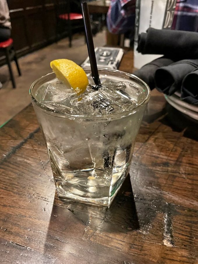 A properly made cocktail is poetry in a glass. This one, with its perfect ice and lemon garnish, tells a story of civilization and good taste.