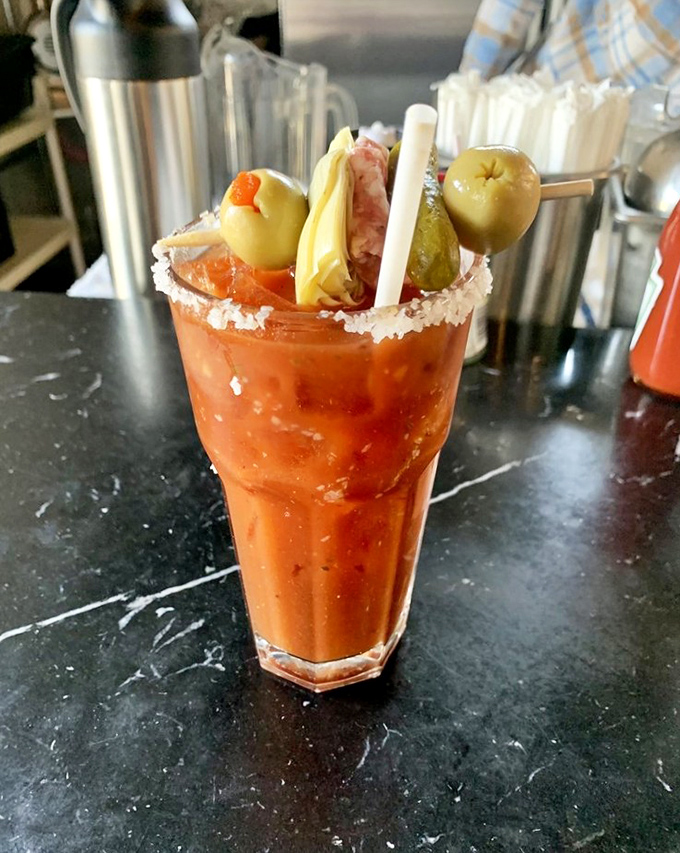 Not your average Bloody Mary—this drink comes with its own appetizer board. A meal in a glass that makes Sunday mornings worth getting up for.