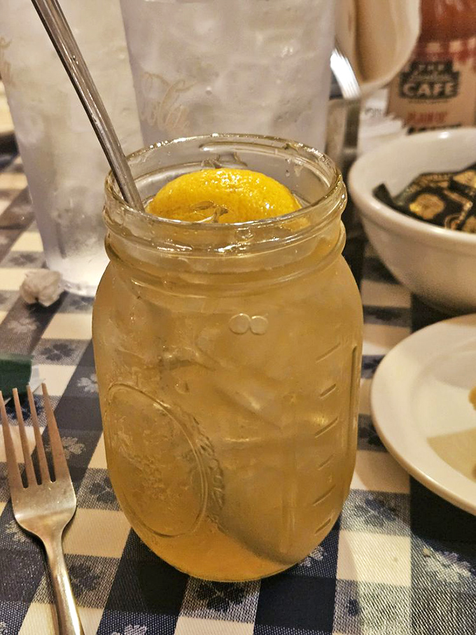 Sweet tea served in a mason jar&mdash;because in Tennessee, proper hydration comes with a side of Southern tradition and a lemon slice.