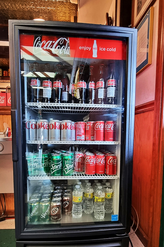 The vintage soda fridge isn't just storing beverages; it's preserving the sacred tradition of pairing fizzy drinks with frozen treats.