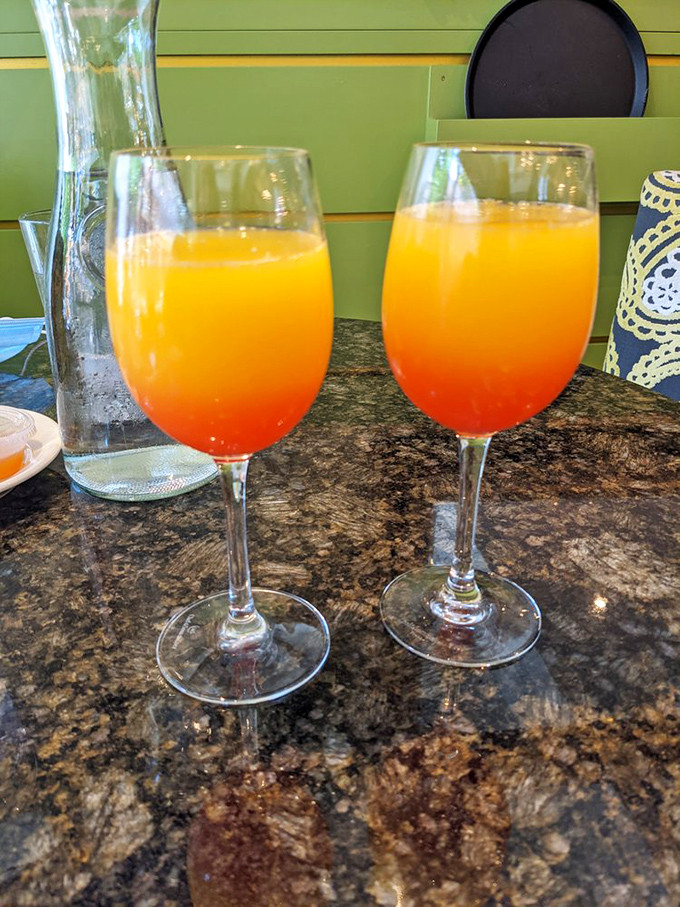Sunrise in a glass! These gradient mimosas transition from sunny yellow to fiery orange&mdash;liquid sunshine to kickstart your Portland morning.