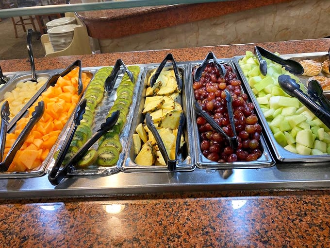 The fruit section offers a moment of virtuous eating before you inevitably return to the fried chicken. It's all about balance, right?