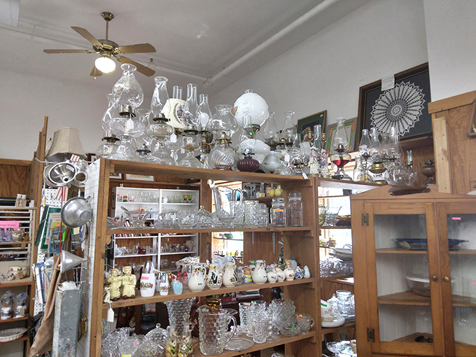 Crystal and glassware catching light like diamonds, each piece whispering tales of holiday dinners and special occasions from decades past.