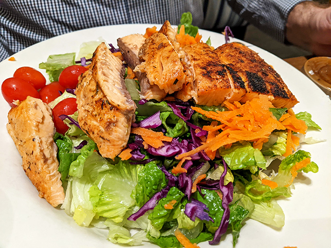 A salad that doesn't feel like punishment. Grilled salmon adds protein power to this colorful garden party.