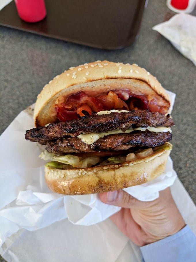 The sesame seed bun serves as both crown and throne for this royal arrangement of beef, cheese, and fresh vegetables. Long live the burger king of Phoenix.