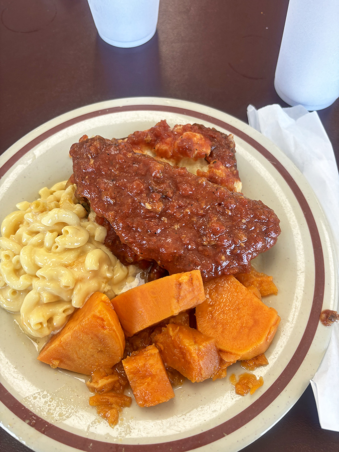 Meatloaf that doesn't apologize for being meatloaf. Bold, saucy, and flanked by mac and cheese and sweet potatoes that know their worth.