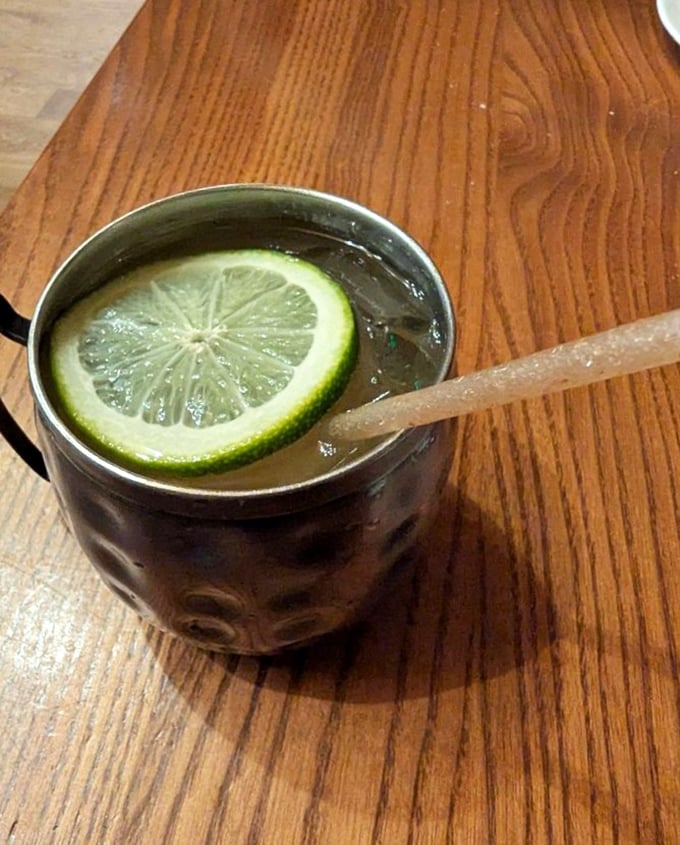 The Moscow Mule arrives in its copper throne, lime crown perched atop, ready to refresh even the weariest Colorado adventurer.