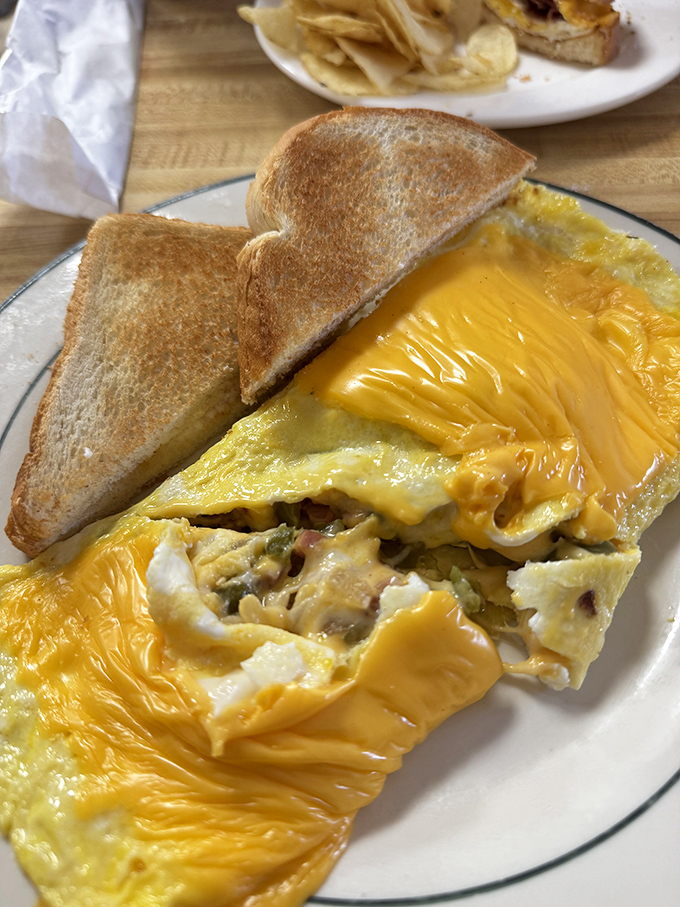 This isn't just an omelet &ndash; it's a treasure chest of breakfast goodness where the X marks the spot with perfectly melted cheese.