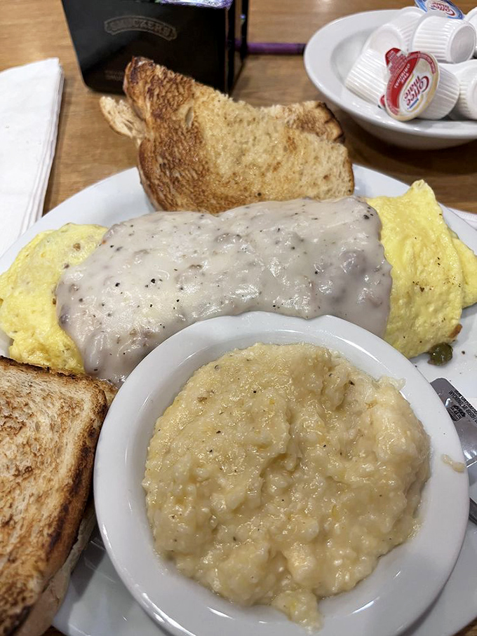 When an omelet is draped in sausage gravy alongside creamy grits, you're not just eating breakfast&mdash;you're experiencing Southern hospitality on a plate.
