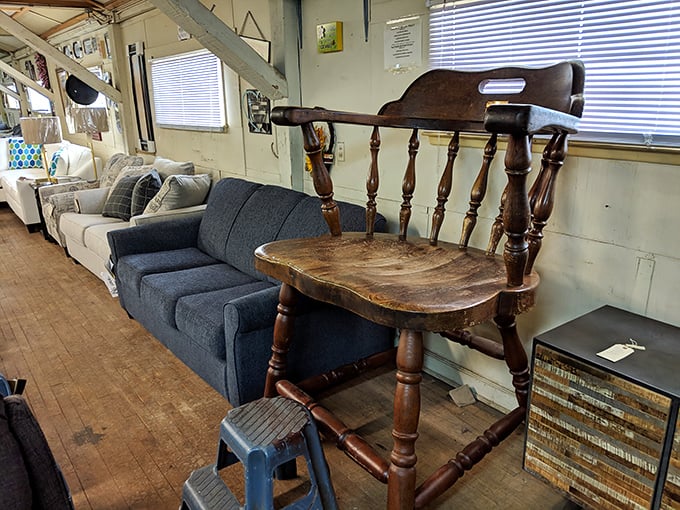 That oversized wooden chair commands attention like a throne fit for the most distinguished family patriarch.