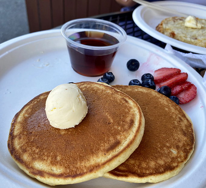Golden pancakes with a scoop of butter slowly melting into warm pools of deliciousness—the breakfast equivalent of a warm hug.