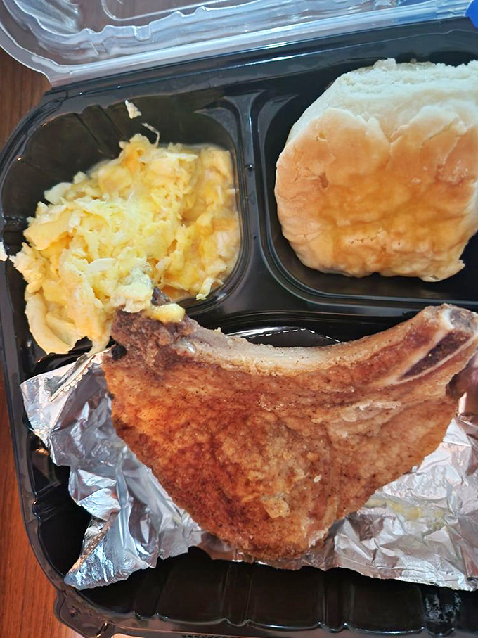 This isn't just a pork chop&mdash;it's a masterpiece of seasoning and technique. Paired with potatoes and a biscuit for the ultimate comfort trifecta.