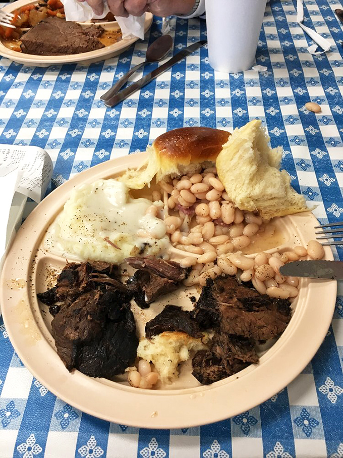 Pot roast so tender it surrenders at the mere suggestion of a fork, accompanied by beans that clearly got the memo.