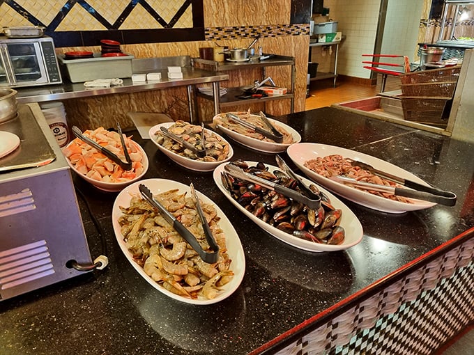 A seafood spread that would make Poseidon himself jealous. Each dish carefully arranged, waiting to be discovered like treasures from the deep.