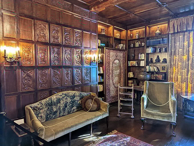 Intricate wood paneling transforms this intimate reading room into a cocoon of culture&mdash;the kind of space where you'd expect to find leather-bound first editions and well-kept secrets.