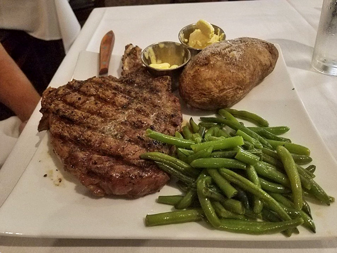 Simple perfection on a plate&mdash;this ribeye with green beans and baked potato proves that classics become classics for good reason.