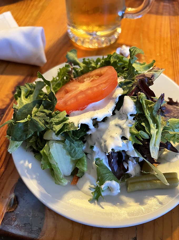 Even the salad gets the royal treatment. Fresh greens, ripe tomato, and a creamy house dressing that makes eating vegetables feel like cheating.