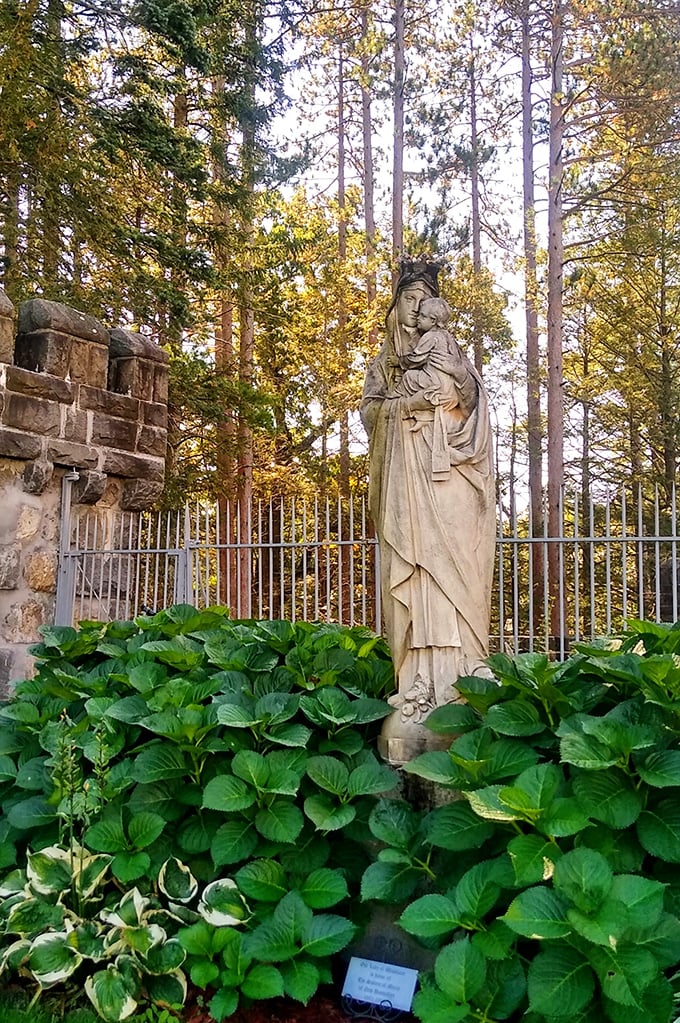 Nestled among lush greenery, this serene statue adds a touch of grace to the castle grounds, standing as a silent guardian through changing seasons.