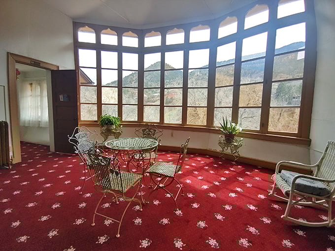 The solarium's curved windows frame the Colorado mountains like a Victorian Instagram filter&mdash;#NoFilterNeeded, just architectural brilliance.