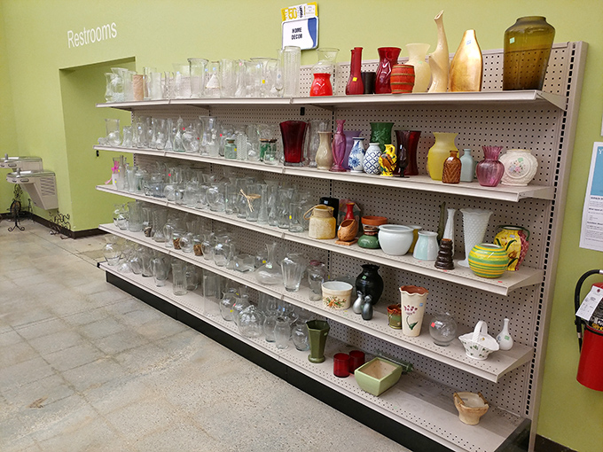 Vases of every shape and hue stand like colorful sentinels. One person's decluttered shelf becomes another's design statement.