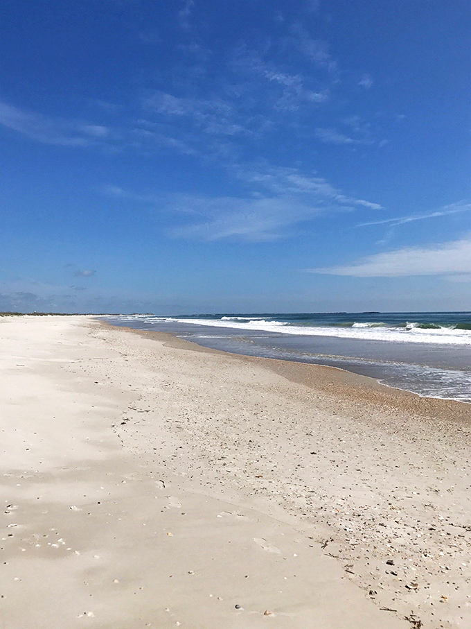 Ocean waves performing their endless symphony. Here's where the Atlantic makes its grand entrance, one rolling crescendo after another against untouched shores.
