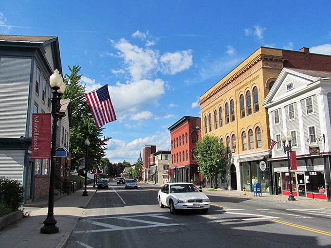 Stroll through downtown Adams, Massachusetts, where historic architecture meets small-town charm under a bright, beautiful sky. You'll love the atmosphere!