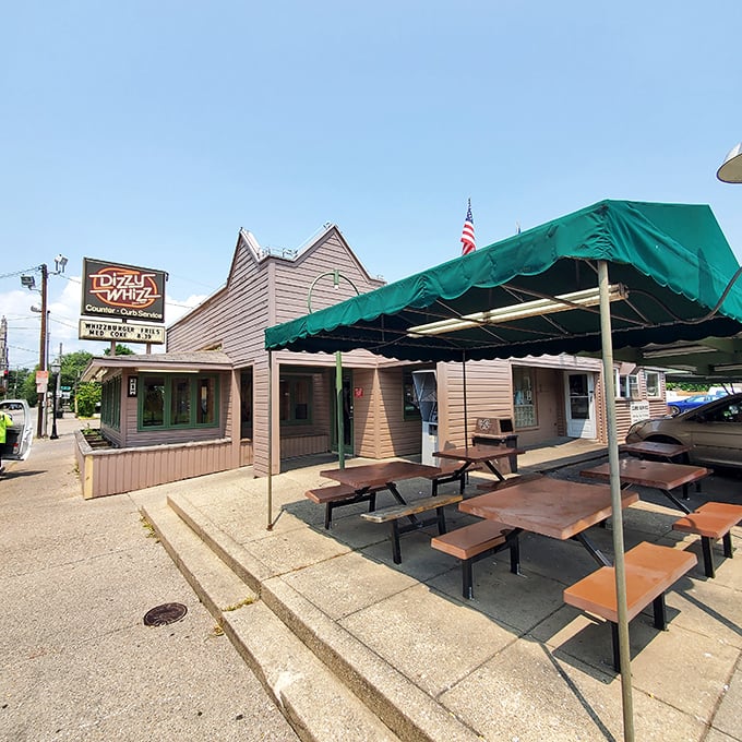 Dizzy Whizz's distinctive awnings aren't just sheltering hungry diners—they're protecting a Louisville burger tradition worth cherishing.