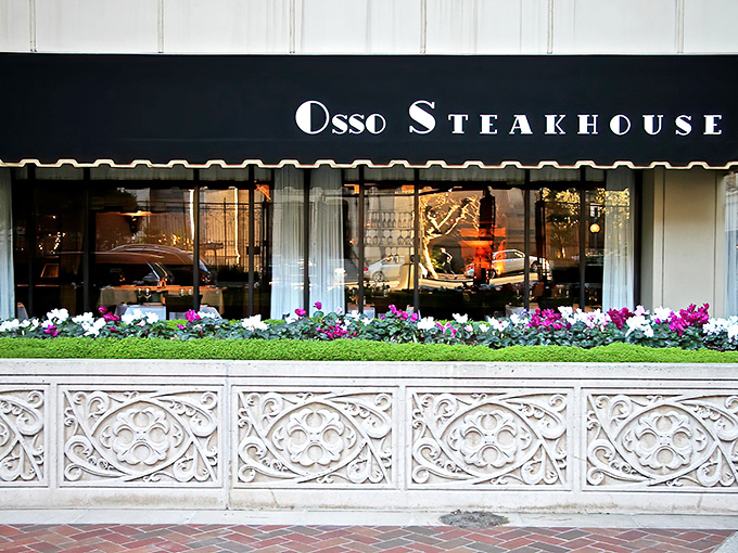 Osso Steakhouse: Elegant flower boxes frame a sophisticated urban steakhouse. Inside, those white tablecloths are about to witness pure joy.