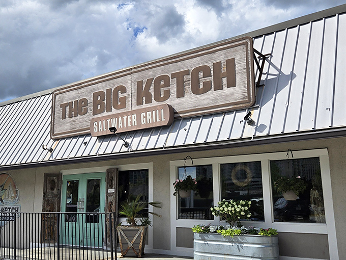 Coastal calling! This weathered wooden sign might as well say 'Beach This Way' for landlocked seafood lovers.