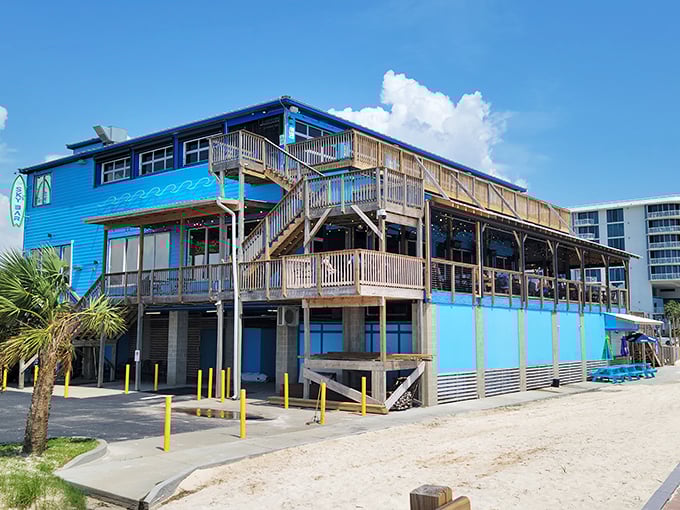 The Reef's multi-level blue building rises from the beach like a seafood paradise. Those decks practically beg you to enjoy shrimp with a view.