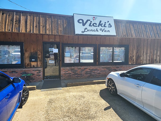 Vicki's wood-paneled exterior feels like the cabin where comfort food goes on vacation – rustic on the outside, burger paradise inside.