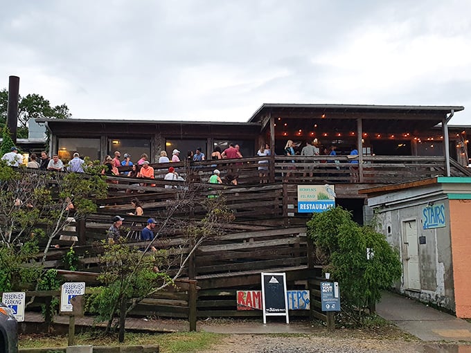 The wooden deck at Bowens isn't just seating &ndash; it's front-row tickets to nature's dinner theater.