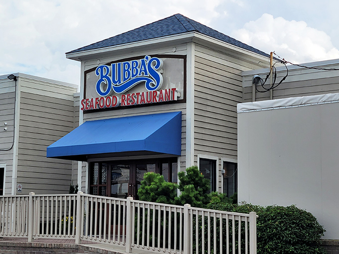 That blue Bubba's sign marks the spot where seafood dreams come true, just steps from where your dinner was swimming.