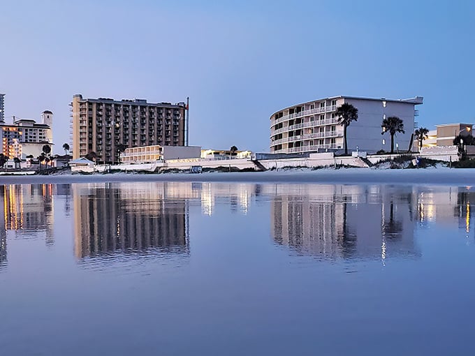 Daytona's beachfront hotels reflect in the morning tide. The perfect spot to watch the sunrise with coffee in hand.
